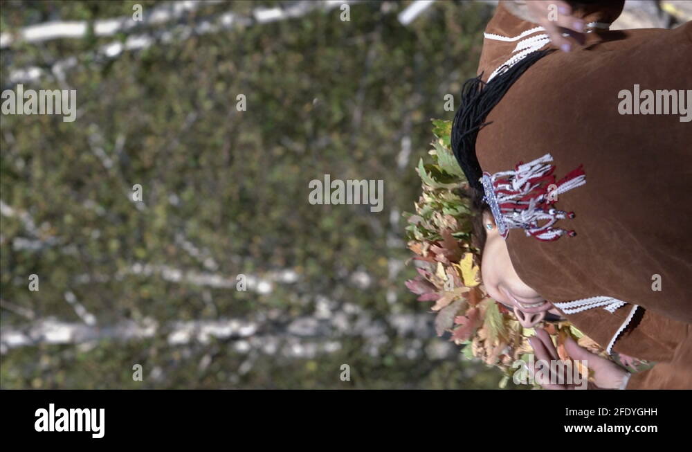 Vertical video woman dancing in traditional clothing of indigenous ...