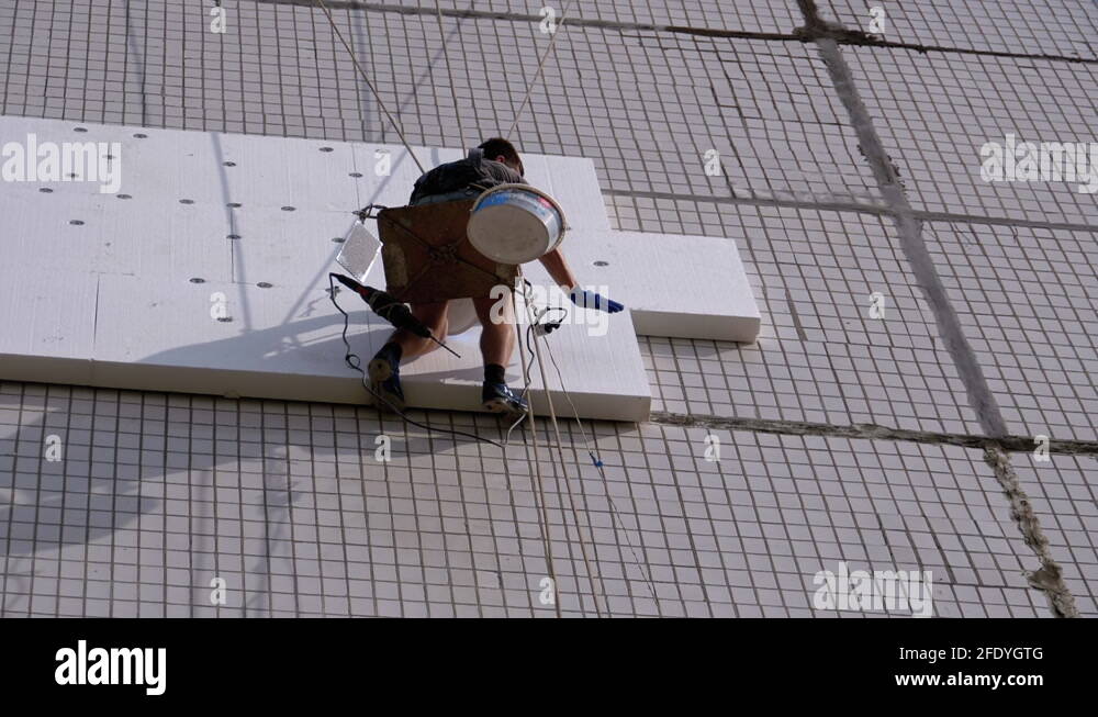 Industrial Climber Insulation of Facade Old High-Rise Building Using ...