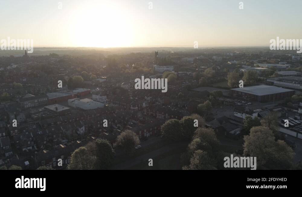 Drone aerial view above British sunrise typical housing silhouette ...