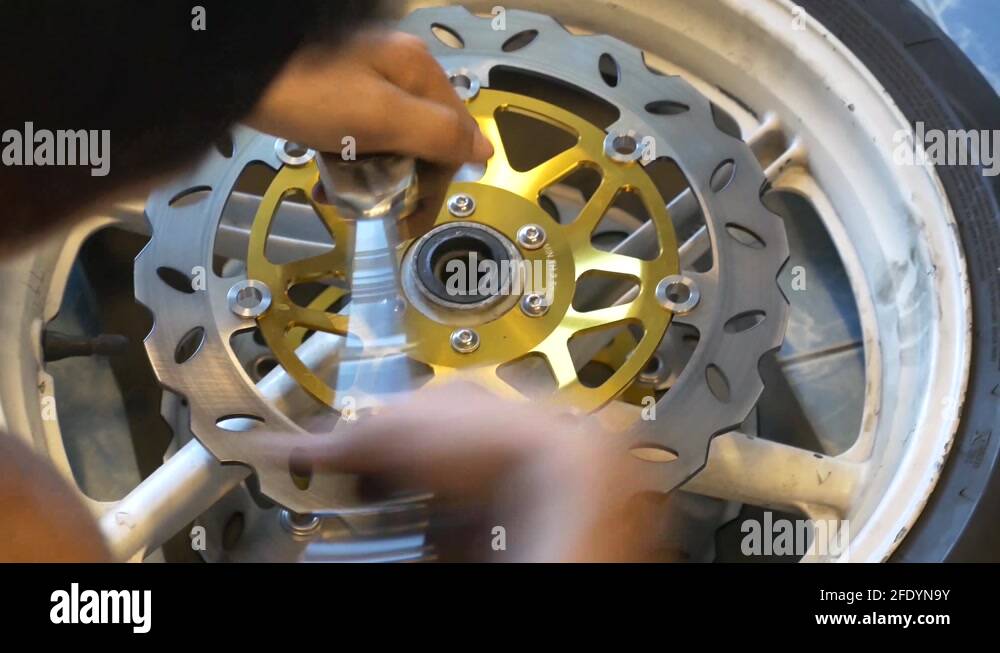 Close-up Footage of Mechanic Working On Disc Brake Installation For ...