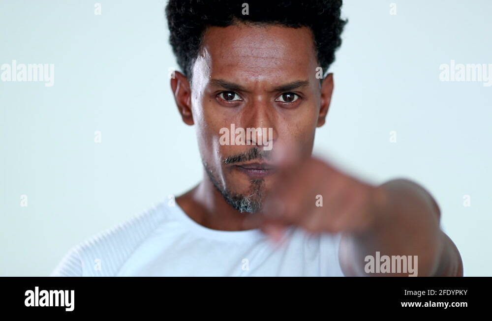 African man pointing finger to camera, Serious black american signaling ...