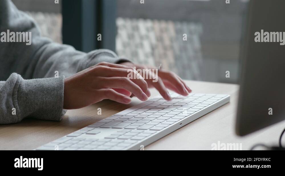 Woman type on keyboard at office Stock Video Footage - Alamy