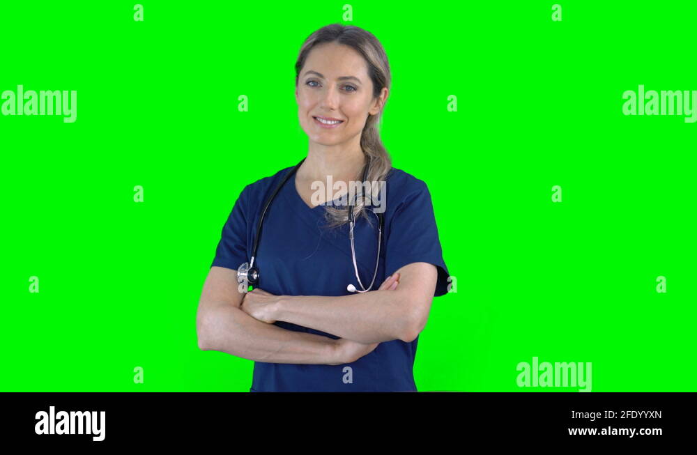 4K Portrait of female nurse doctor on green screen isolated with chroma ...