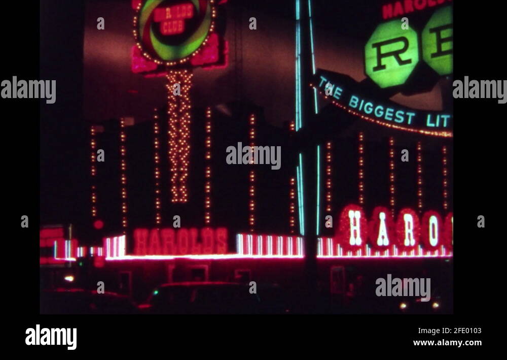 1970s: Neon Reno sign at night. Neon lights for Silver Dollar Club ...
