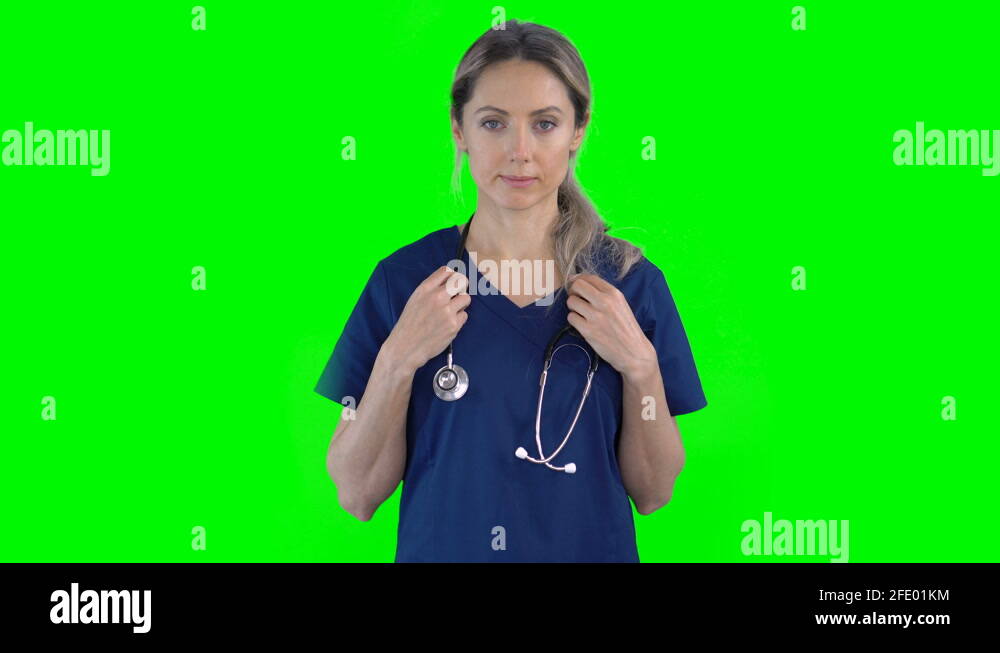 4K Portrait of female nurse doctor on green screen isolated with chroma ...