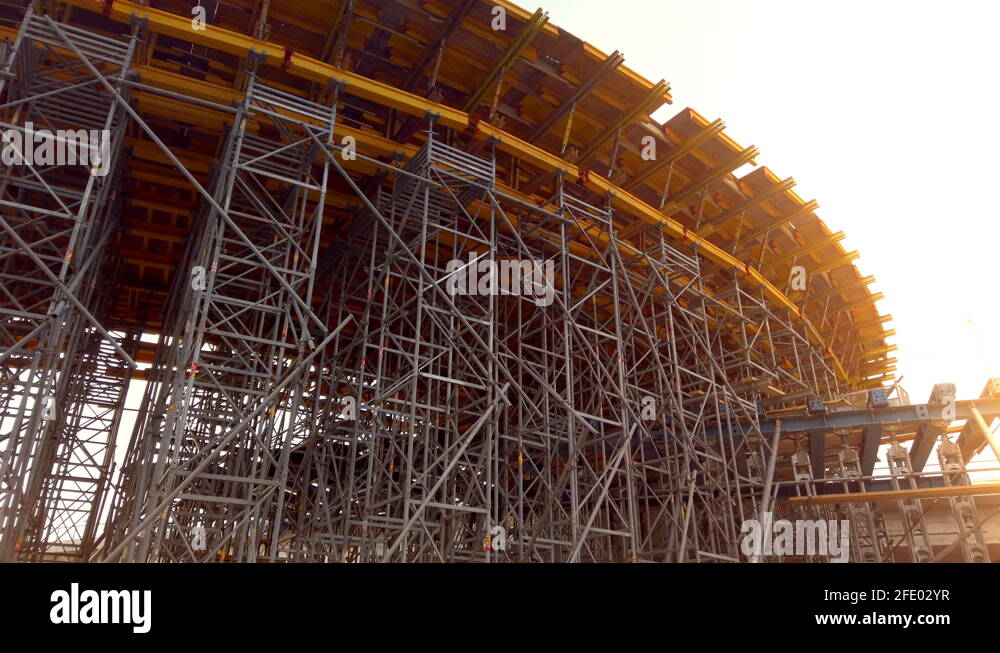 Building construction site, scaffolding on a construction pillar at a ...