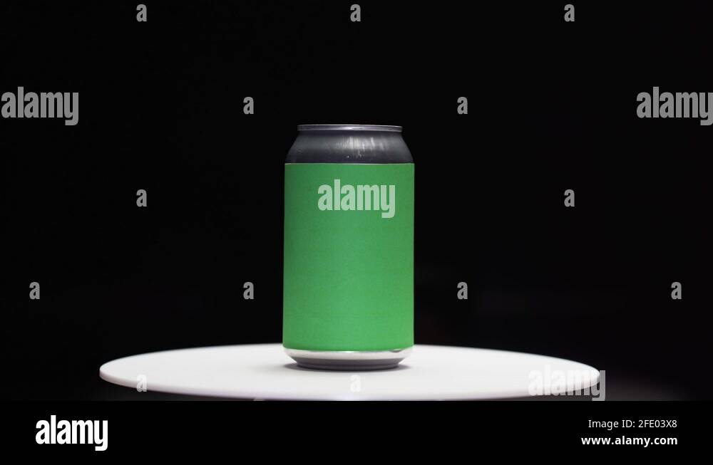 Soda or beer can with chroma green screen label spinning on turntable ...