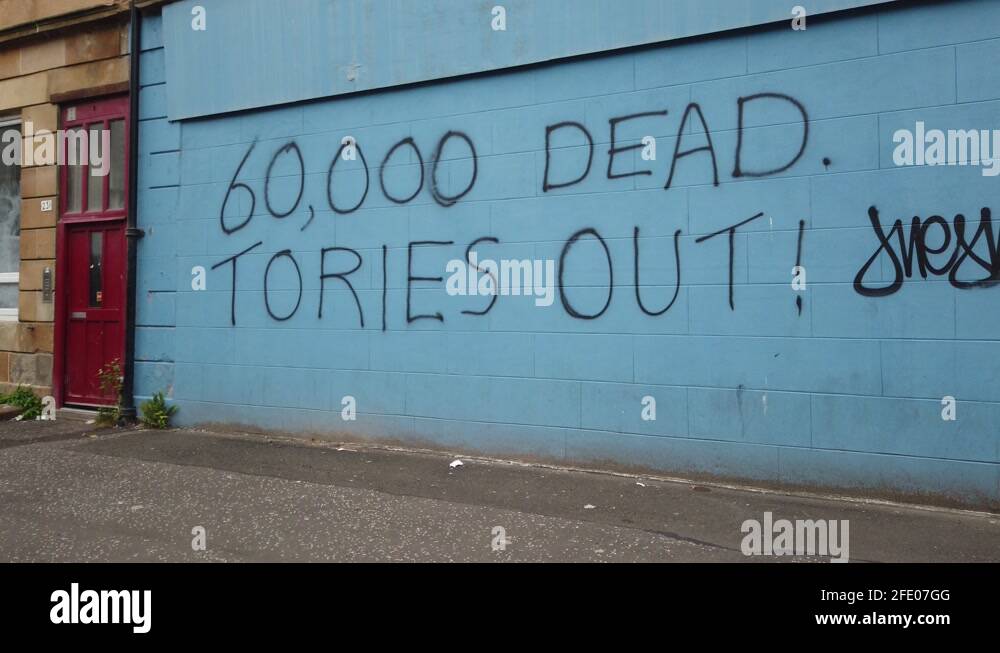 Anti- Conservative graffiti on a corner shop wall. This was taken ...