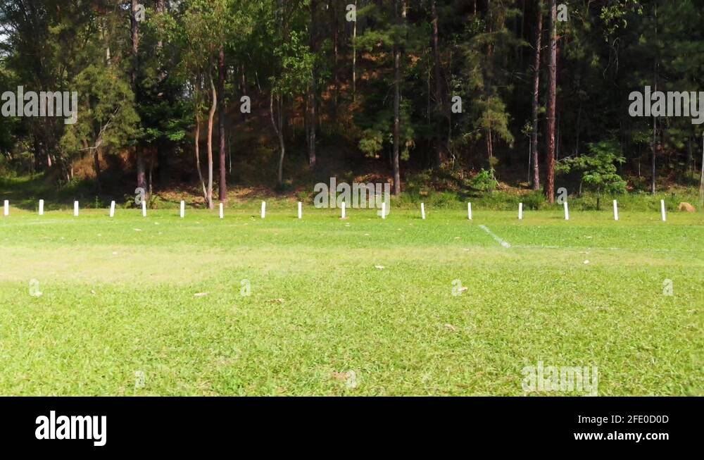 Low drone flight sideways in soccer field with goal in the middle. São ...
