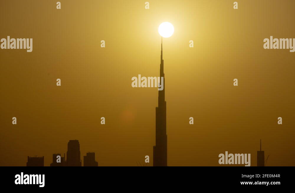 sun on top of the world tallest building dubai timelapse 4k united arab ...