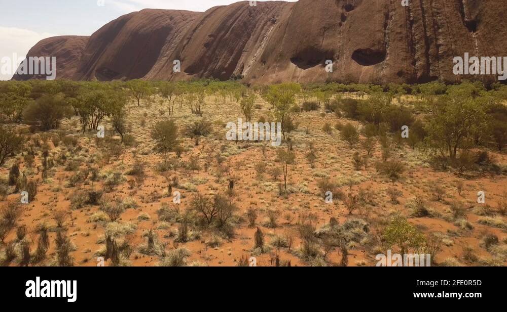 Uluru/Ayres Rock, dramatic view flying towards the iconic Australian ...