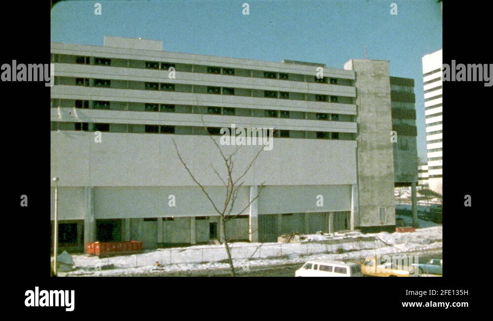 1970s: buildings on city street with cars, sign: "Hyatt Regency Hotel ...