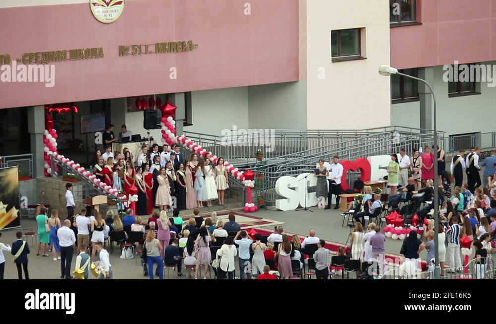 School Graduation Celebration. Graduates sing on the steps of the ...