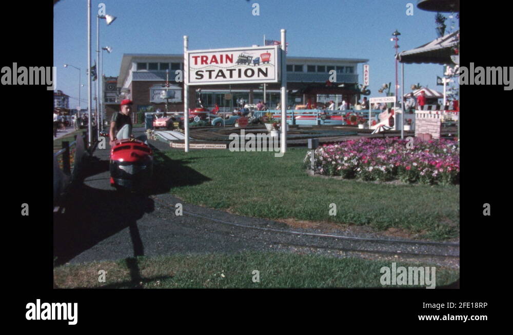 1960s: People ride on carnival train ride. People riding carnival rides ...