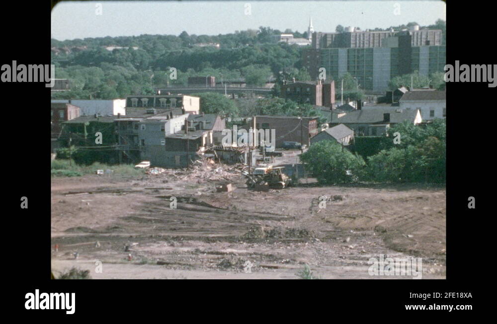 1970s: buildings and demolition wreckage, bulldozer, old buildings with ...