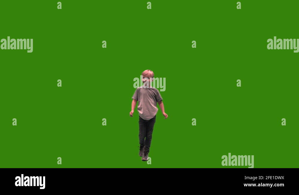 young boy on green screen jumping up. Easy chroma keying by just one ...