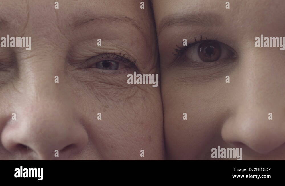 Mother and daughter, face close-up, generations, look alikes, happy ...
