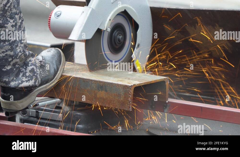 Construction worker cutting steel C-shape Channel frame with cutting ...