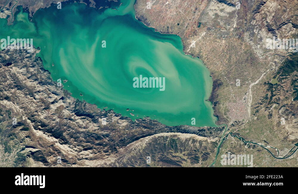 Lake aerial satellite view with scenic water vortex zoom in Stock Video ...