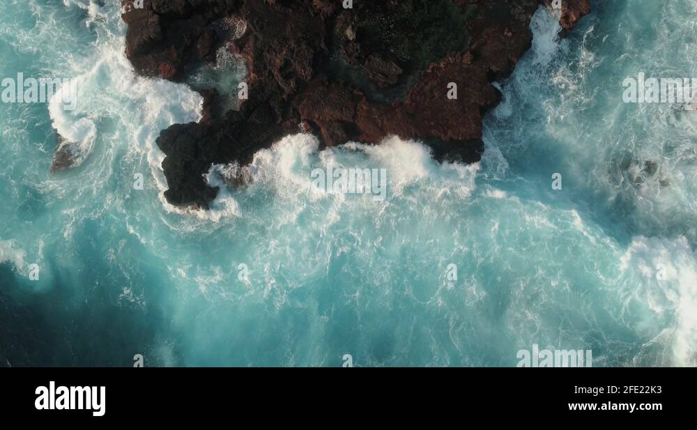 Top down views of ocean action on rocks Stock Video Footage - Alamy