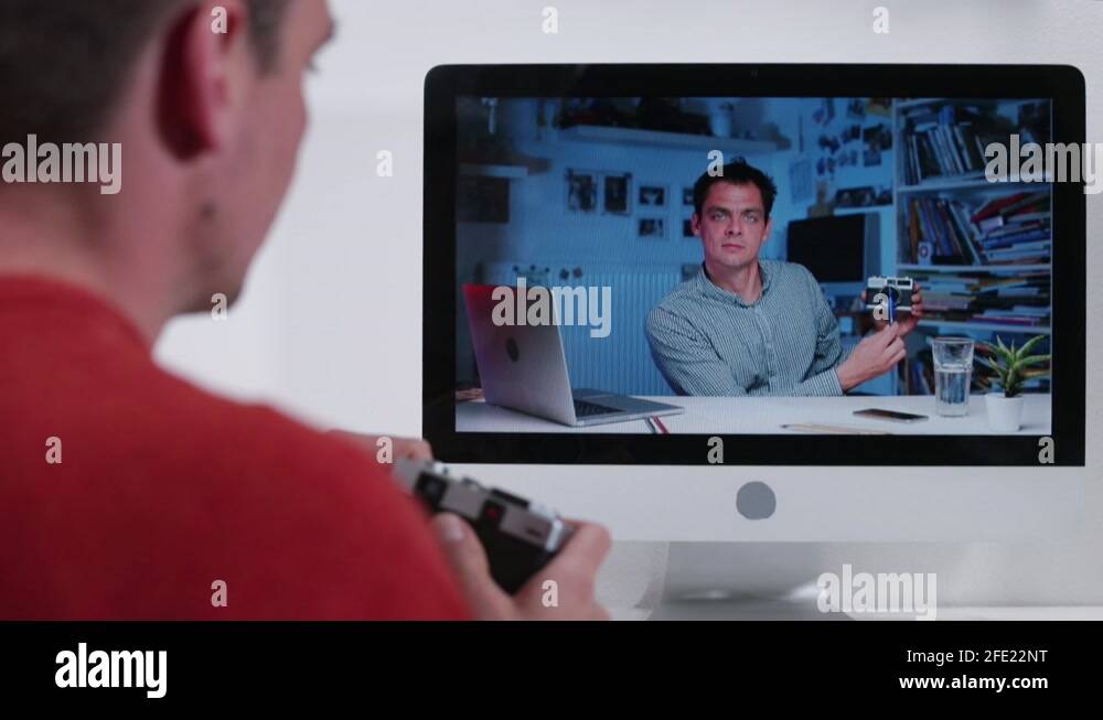 A man watching a photo lesson in an online school Stock Video Footage ...