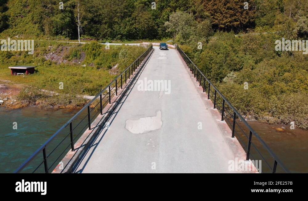 A car driving over a bridge front view Stock Video Footage - Alamy