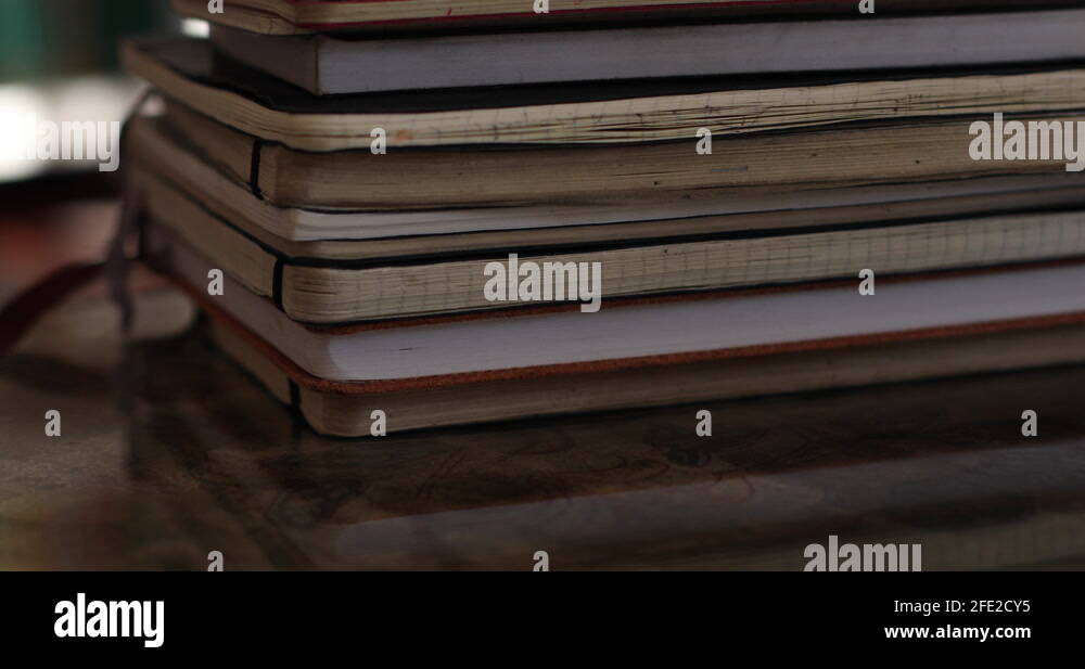 Pile notebooks Stock Videos & Footage - HD and 4K Video Clips - Alamy