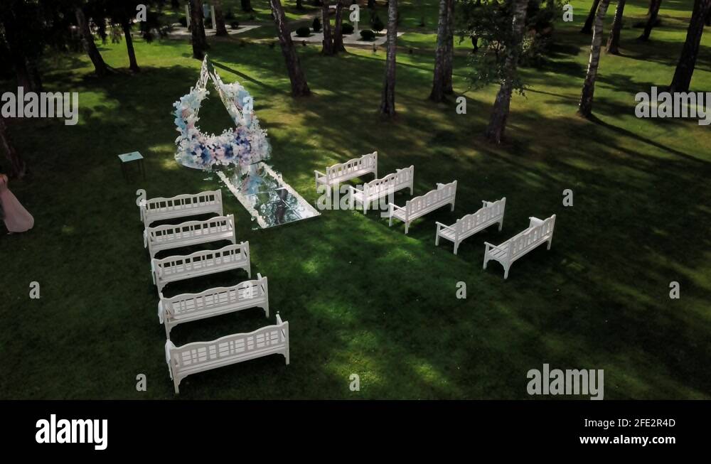 triangular arch for registration. White benches stand in two rows Stock ...