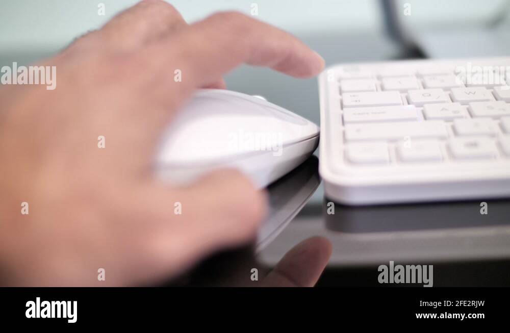 Using left handed mouse, desktop computer keyboard typing, keypad ...