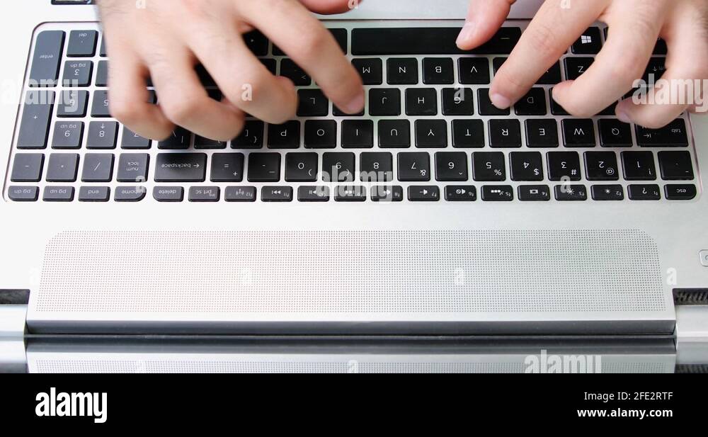 Man typing on a laptop keyboard top view Stock Video Footage - Alamy
