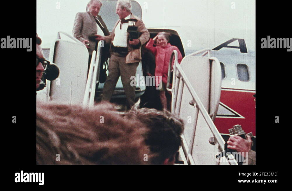 1960s Oregon: Crowd of people stand behind rope line. Robert F. Kennedy ...