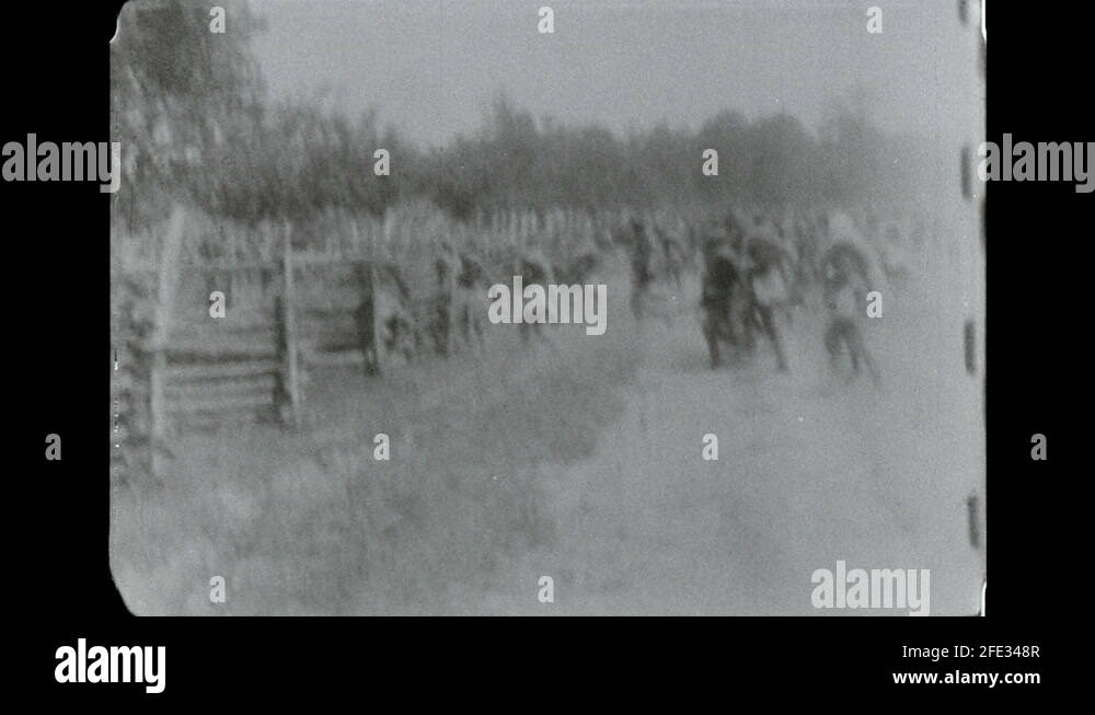 Field, trees, military exercise, group of men in uniform run, carry ...