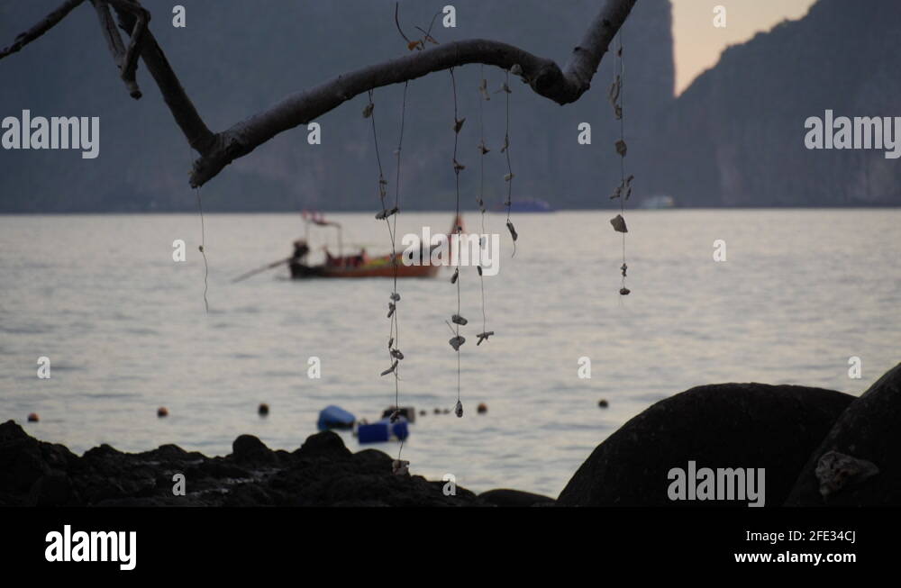 Capture of boating float in Thailand. Framing with detail of rocks and ...