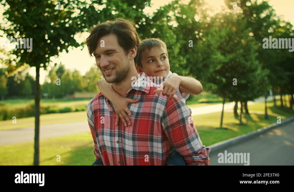 Man carrying boy Stock Videos & Footage - HD and 4K Video Clips - Alamy