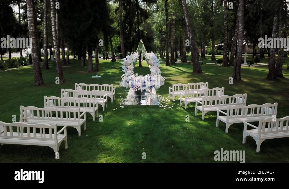 triangular arch for registration. White benches stand in two rows Stock ...