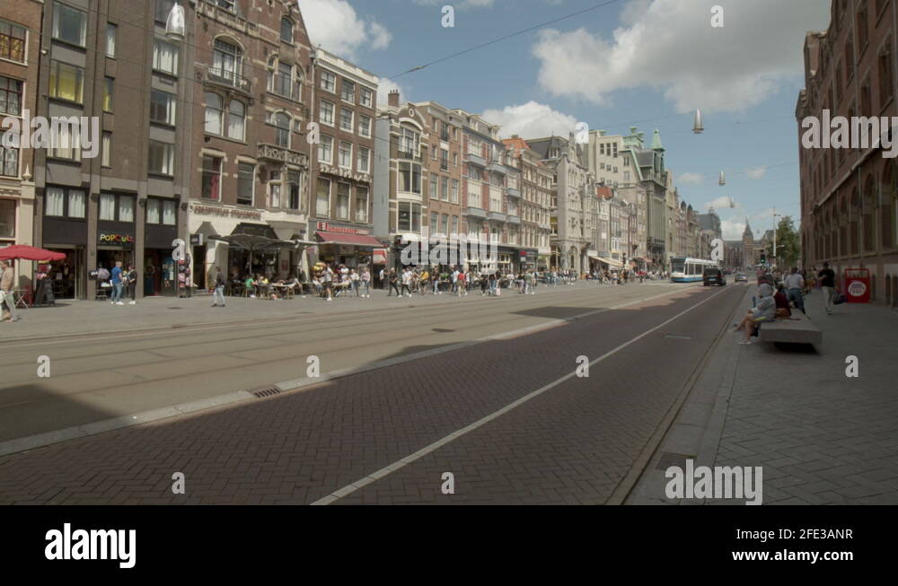 Trams and traffic passing through busy main street in the city centre ...