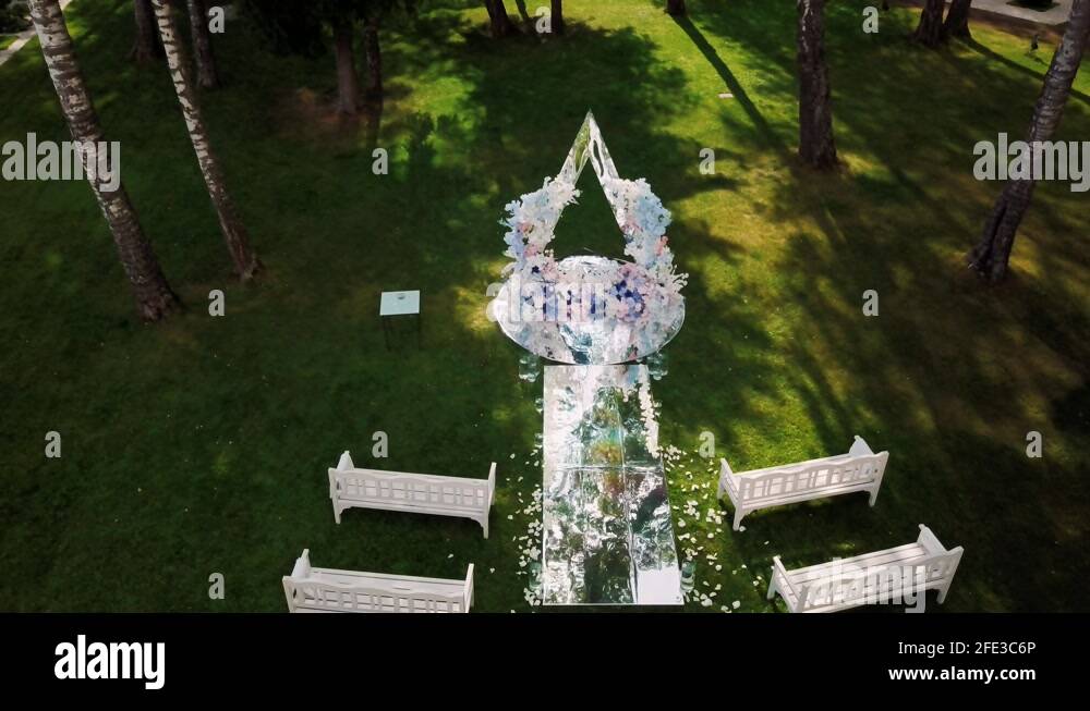 triangular arch for registration. White benches stand in two rows Stock ...