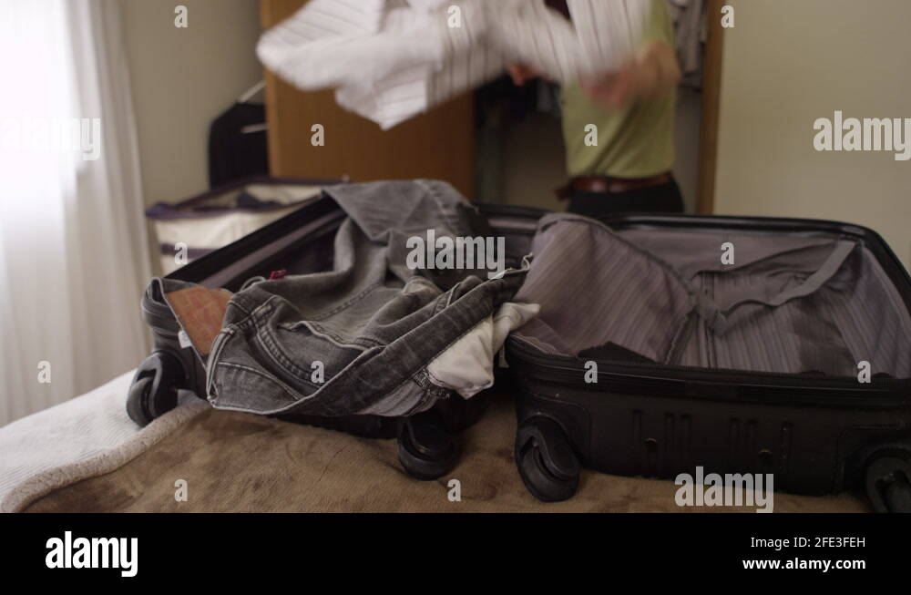 Suitcase man bed Stock Videos & Footage - HD and 4K Video Clips - Alamy