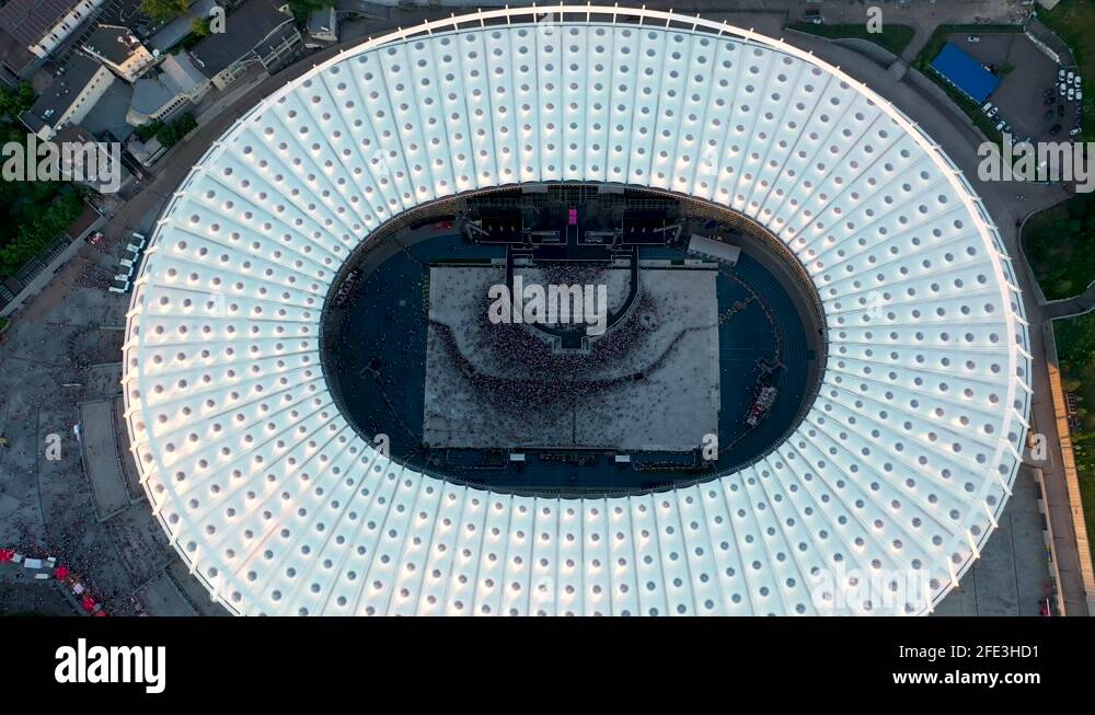 Flying by a drone near the stadium National Sport Complex over a crowd ...
