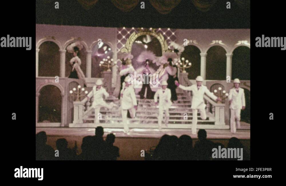 1960s: Dancers on stage, zoom in on woman singing. Man and woman ...