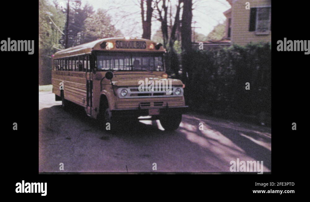 1970s: school bus pulling up to local grocer to pick up children ...