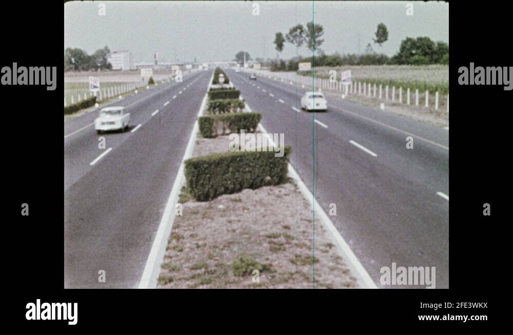 1970s: Cars on highway. Factory. Man works with molten metal Stock ...