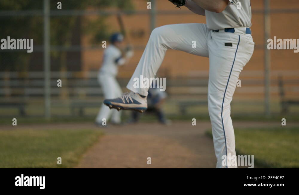 Bringing the heat. Pitcher throws a fastball down the line towards a ...