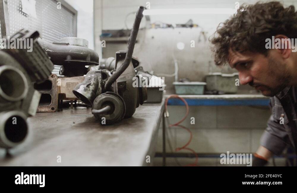 Auto mechanic begins repairing a turbine of a modern car Stock Video ...