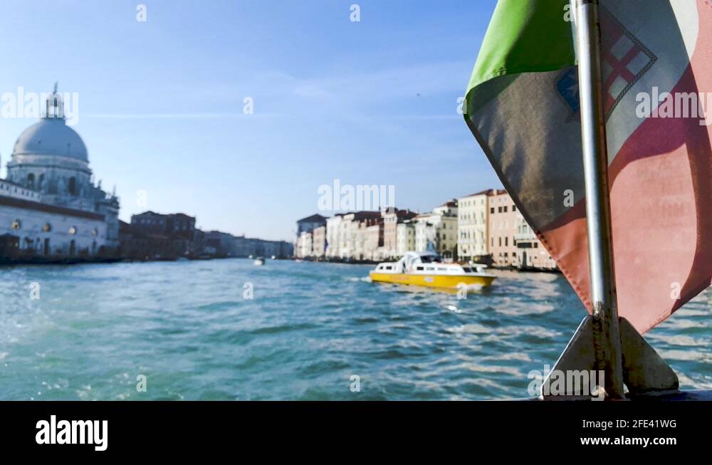 Italian Flag On A Boat Waving In Venice, Italy With Basilica di Santa ...