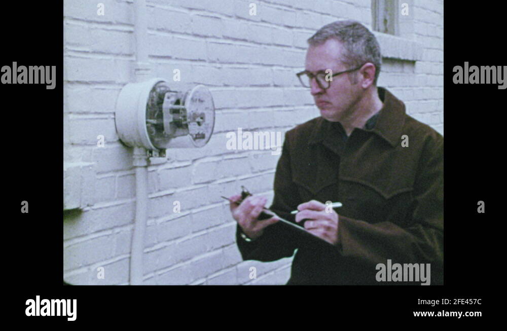 1970s: Meter reader reads meter on back of house. Gas meter. Water ...