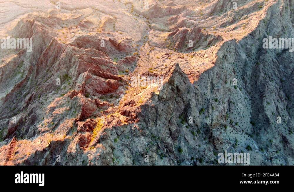 Textured height with morning sun outside Yuma, mountain top down aeiral ...