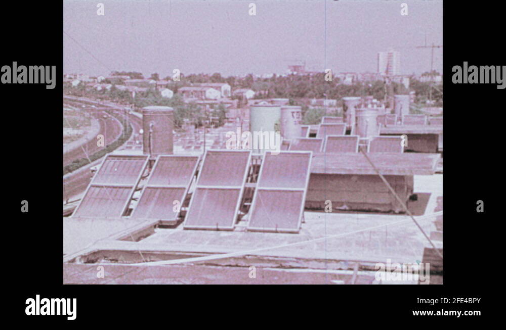 1970s: Solar panels on roofs of buildings. Solar panels on roof of home ...