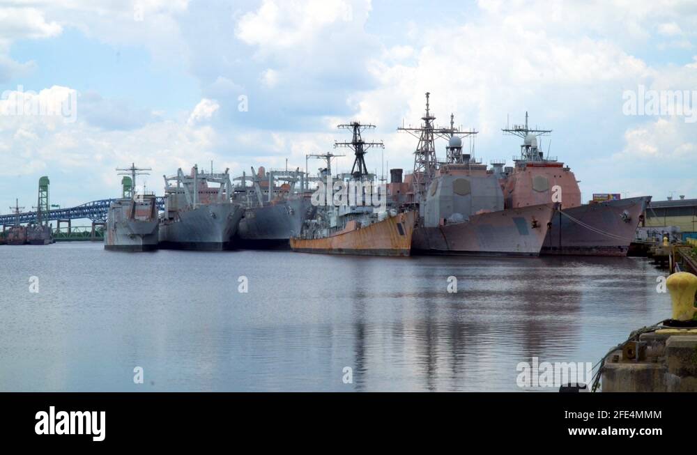 Static footage of old rusty naval ships docked at a shipyard Stock ...