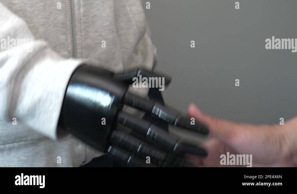 Handshake With an Artificial Prosthetic Hand Stock Video Footage - Alamy